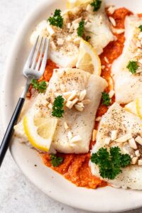 Easy Pan Seared Cod with Romesco Sauce - Well Seasoned Studio