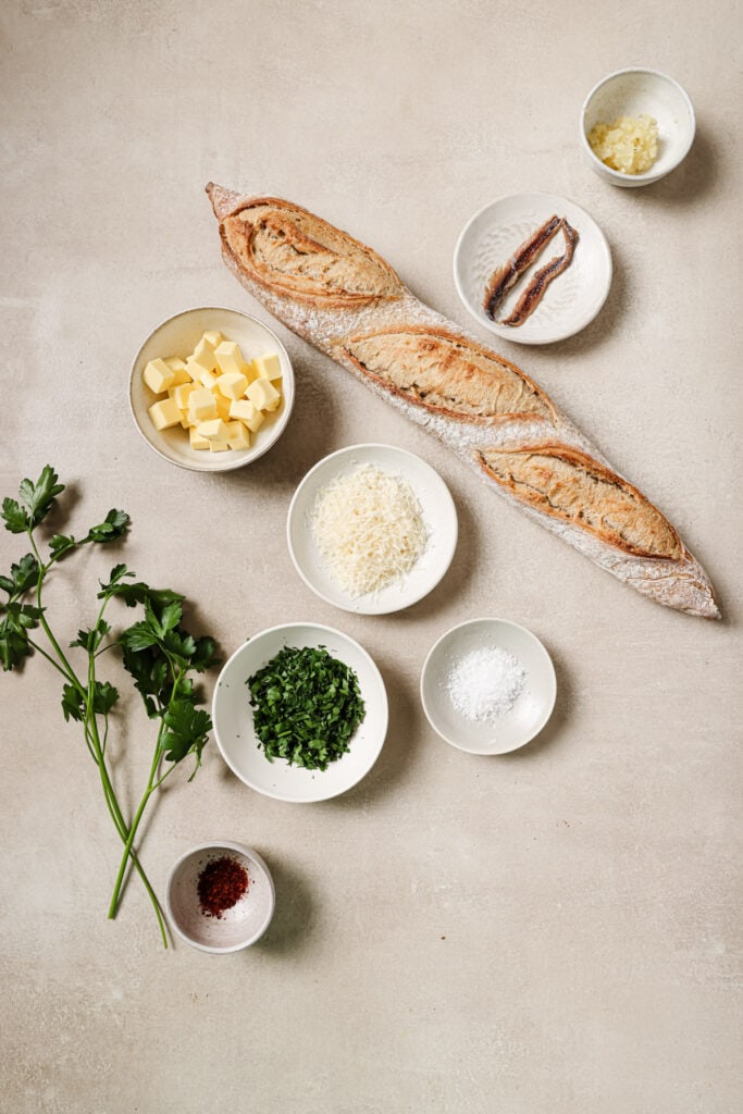 Crispy, Cheesy Garlic Bread with Anchovy Butter - Well Seasoned Studio